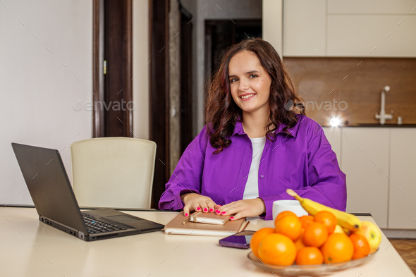 Dedicated Student Studying at Home with Laptop Stock Photo by OlhaRomaniuk