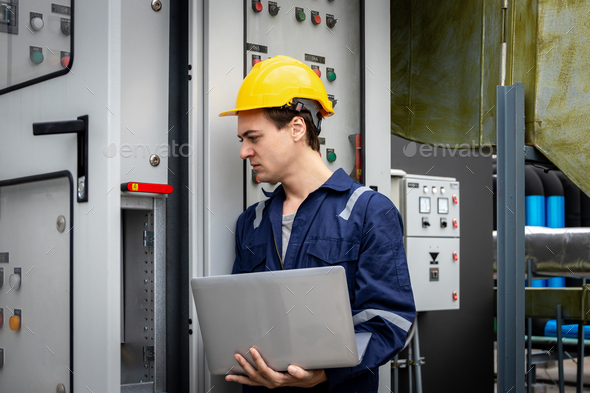 Electrical engineer working in control room. Stock Photo by kckate16