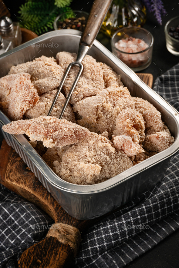 Raw pieces chicken breast breaded ready for frying. Stock Photo by foto ...