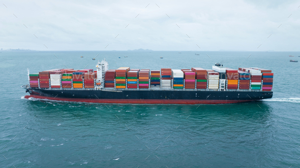 side view Cargo Container ship with contrail in the ocean ship carrying ...