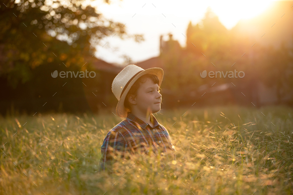Cute little girl having fun in a dandelion field Stock Photo by erika8213