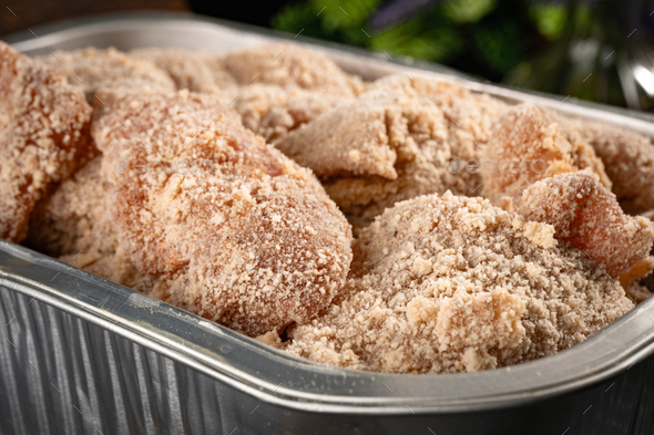 Raw pieces chicken breast breaded ready for frying. Stock Photo by foto ...