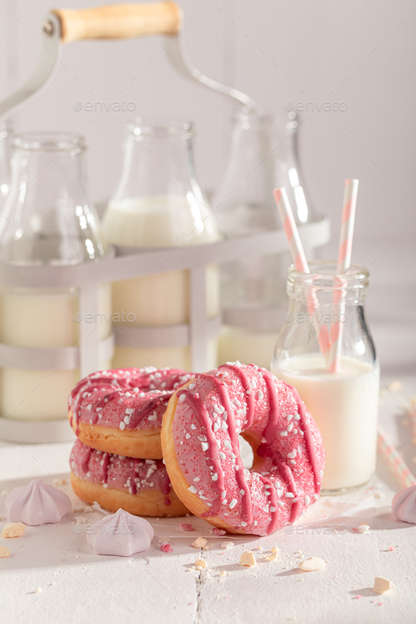 Sweet and delicious pink donuts as after school milky snack. Stock ...