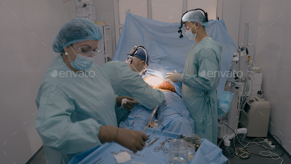 Surgery team professional doctors surgeons perform surgical operation ...