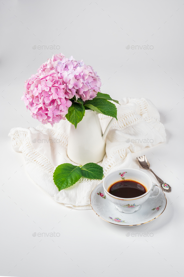 Pink hydrangea with porcelain cup of coffee Stock Photo by Jasmina_K