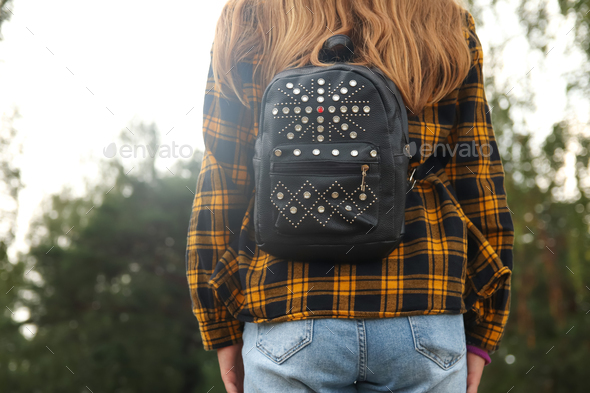 Backpacker. Hipster girl with backpack in woods. Traveler background ...