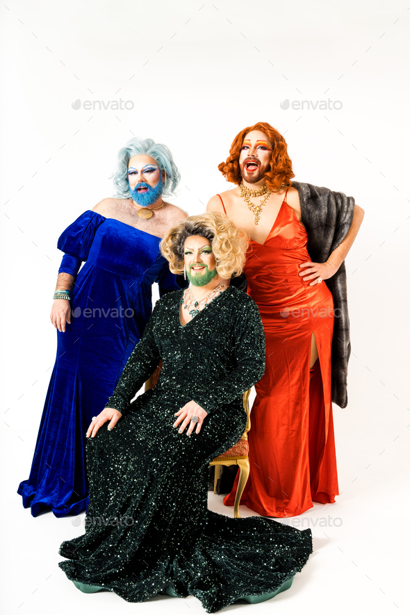 Three Happy Elegant Drag Queens Posed Against a White Background in ...