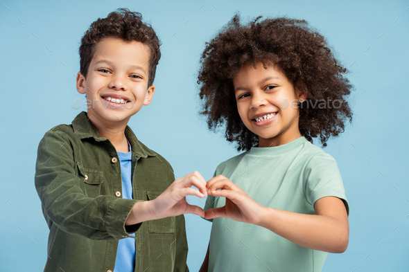 Smiling African American boy and girl positive sister and brother ...