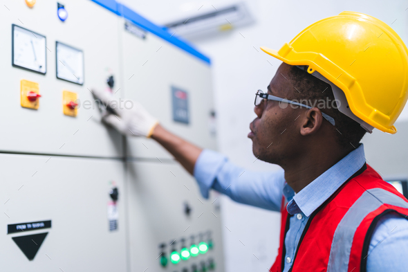 Professional engineering worker programmable logic controller to manage large machine Stock ...