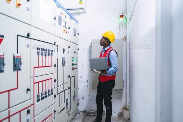 Professional engineering worker programmable logic controller to manage large machine Stock ...