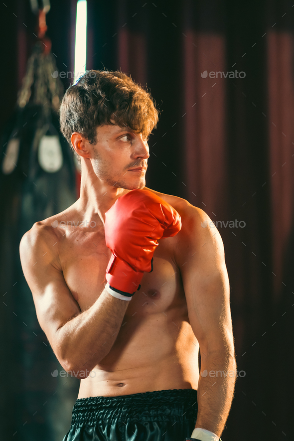 Active athletes fit men kick boxing doing sport training workout in gym ...