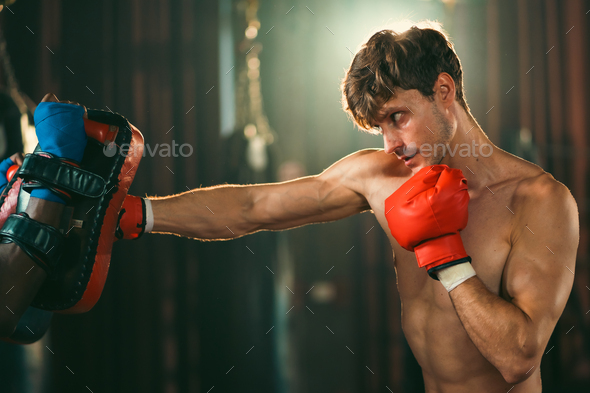Active athletes fit men kick boxing doing sport training workout in gym ...
