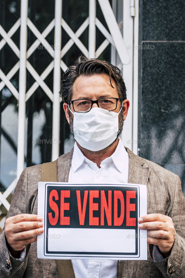 Failed business store man with on sale sign outside his shop wearing ...
