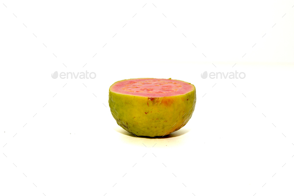cut in half guava isolated on white background Stock Photo by wirestock