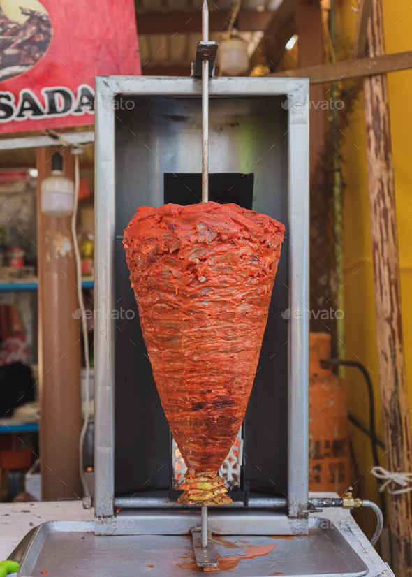 Meat trompo for tacos al pastor. Mexican street food. Marinated meat al ...