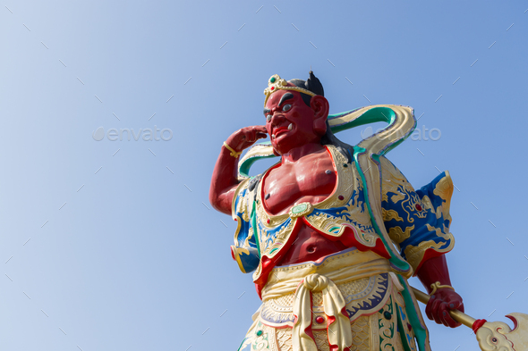 Traditional chinese guard statue over the blue sky Stock Photo by ...