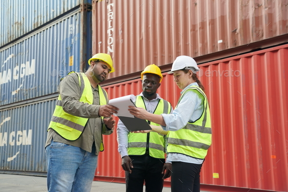 Foreman control loading Containers box from Cargo freight ship for ...