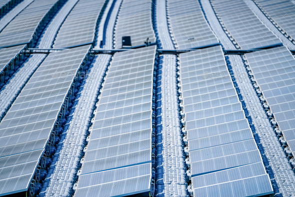 Local worker working at floating solar panels platform on the water of ...