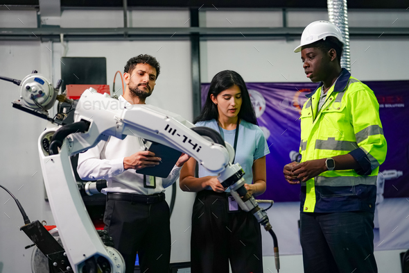 Robotic Arm engineer check on equipment in its with software of ...
