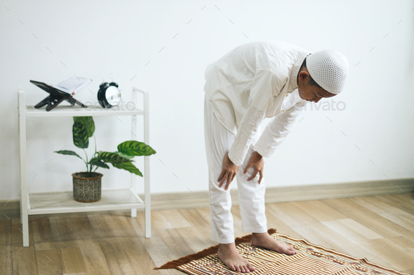 Muslim Boy Praying with Ruku Gesture Stock Photo by Queenmoonlite35