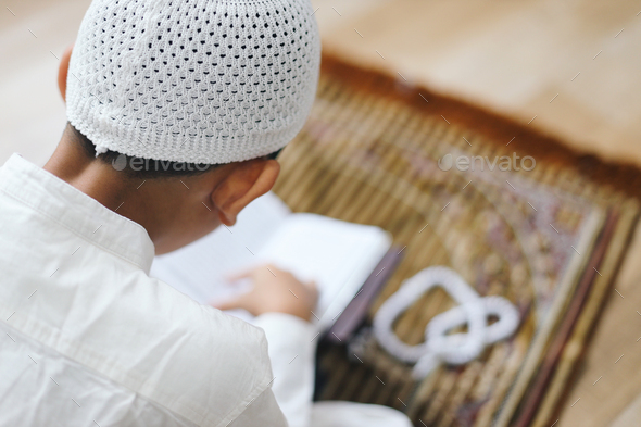 Muslim Boys Reading Koran on Prayer Stock Photo by Queenmoonlite35