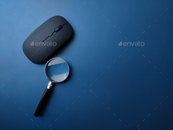 Top view magnifying glass and wireless mouse Stock Photo by Azrin90
