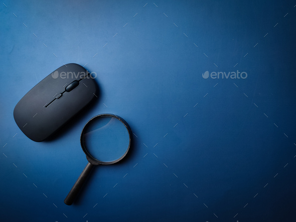Top view magnifying glass and wireless mouse Stock Photo by Azrin90