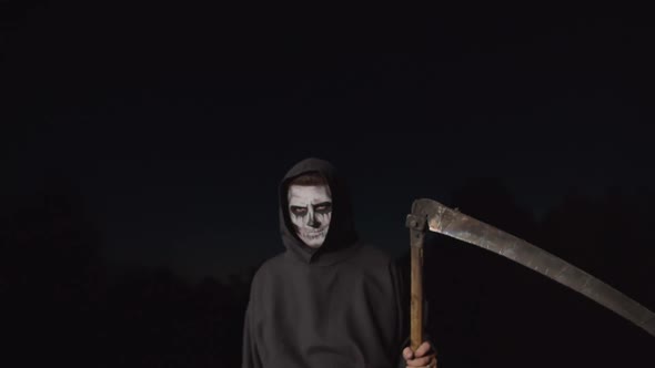Scary Death Reaper with Scythe Creeping at Dusk, Stock Footage | VideoHive