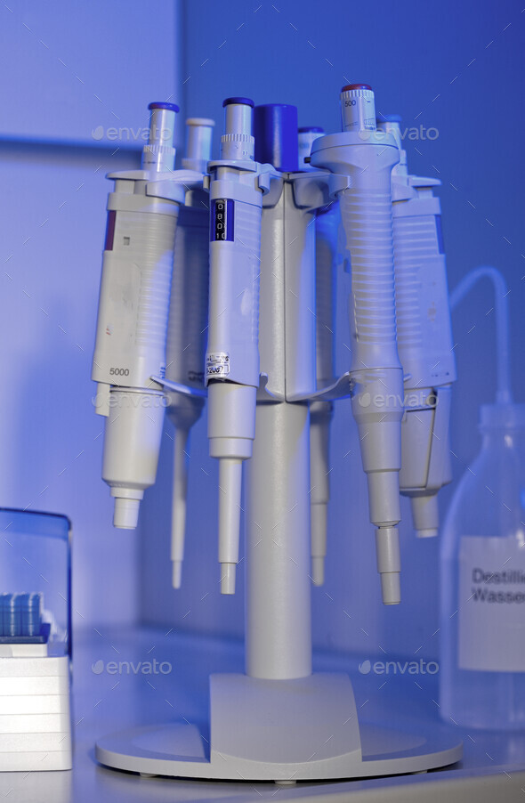 A lineup of precision pipettes in a laboratory setting Stock Photo by ...