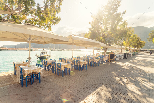 Vassiliki Bay in a sunny spring day with taverna and cafes on Lefkada ...