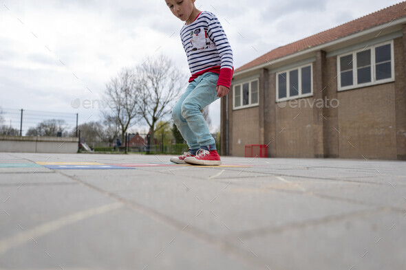 boys playing numbers in a public park. Hopscotch Stock Photo by Image ...