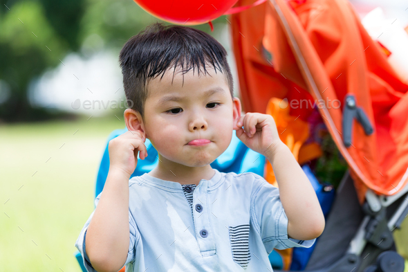 Little boy pinch on his ear Stock Photo by leungchopan | PhotoDune