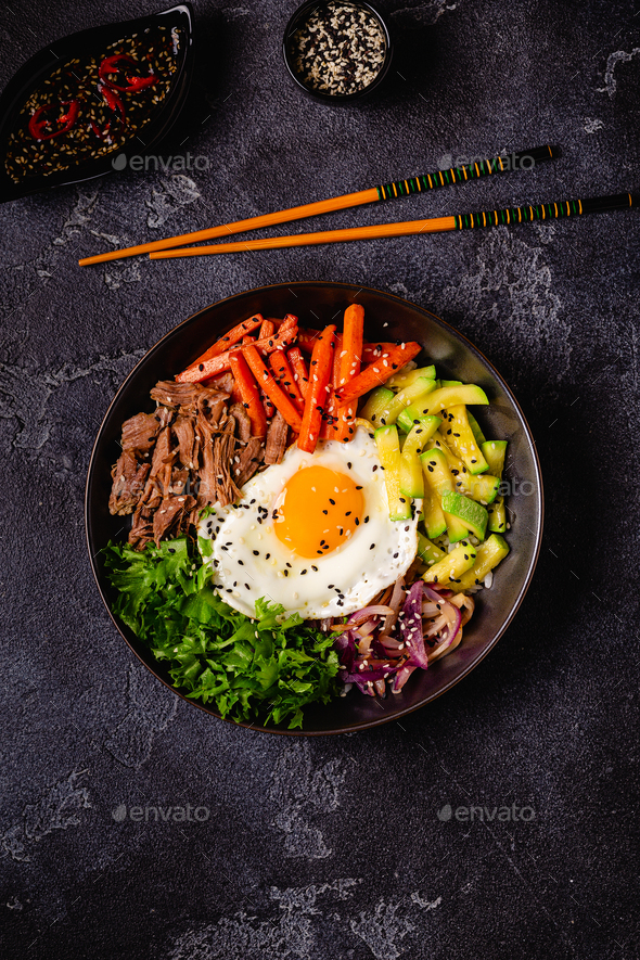 Traditional Korean dish Bibimbap: rice with vegetables beef and egg ...
