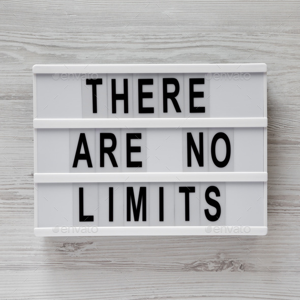Modern box with text 'There are no limits' on a white wooden background ...