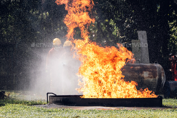 Fire flame in a firefighting training exercise. Firefighter training ...