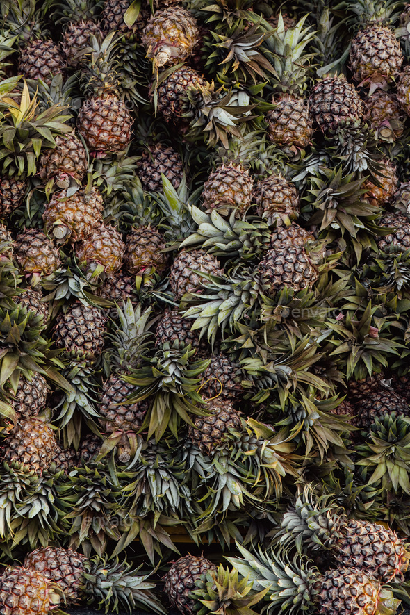 Pile of Hawaiian pineapples top down. Stock Photo by ellinnur | PhotoDune