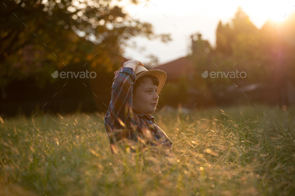 Cute little girl having fun in a dandelion field Stock Photo by erika8213