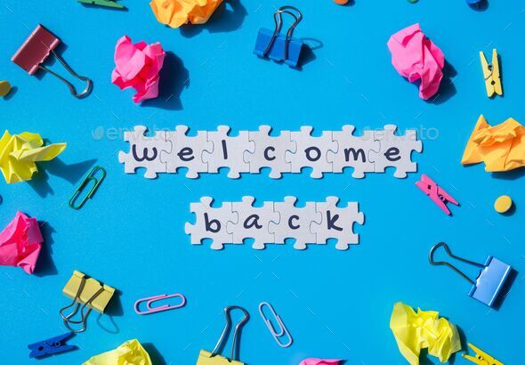 WELCOME BACK to school message inscription text on white puzzles on ...