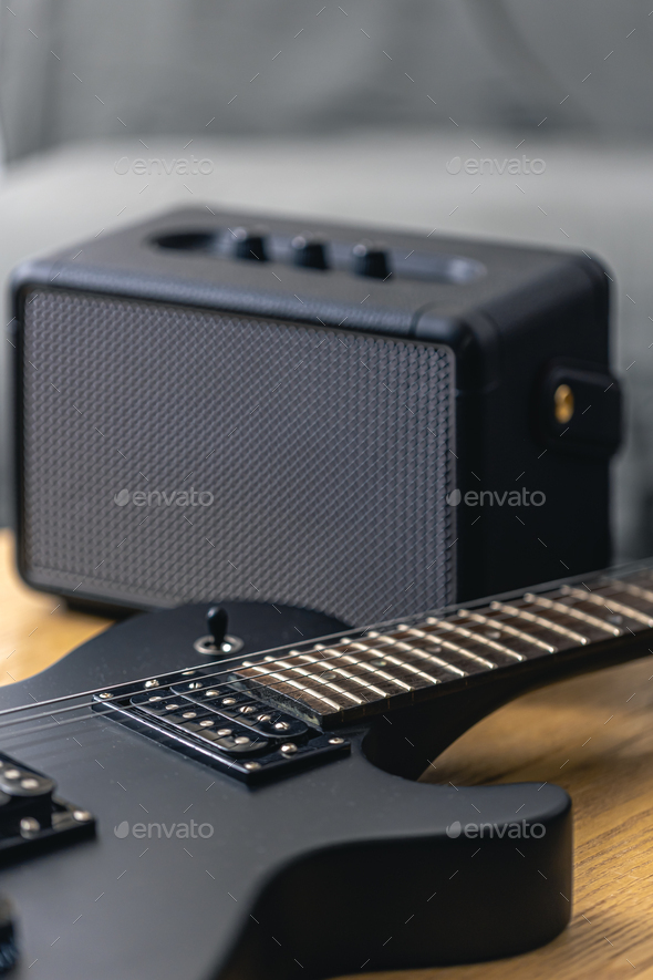 Black electric guitar and speaker close-up. Guitar amplifier, musical ...