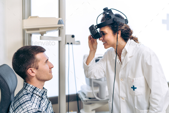 Optometrist Using Advanced Vision Testing Equipment on Patient Stock ...