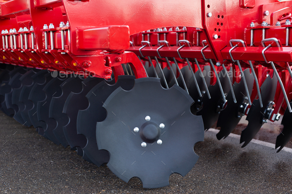 Trailed in-line disc harrow at an agricultural exhibition. Stock Photo ...