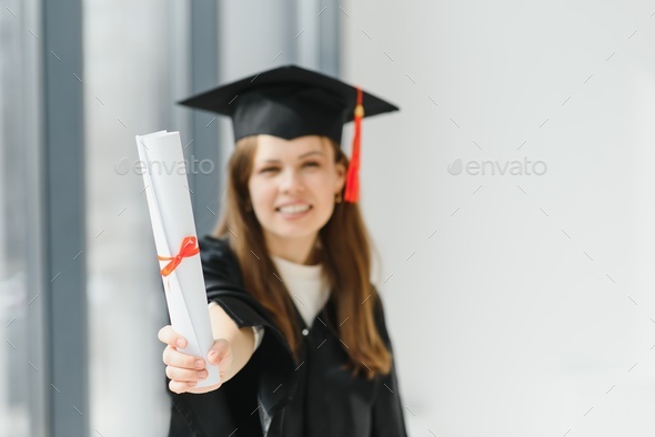 Graduation: Student Standing With Diploma Stock Photo by sedrik2007