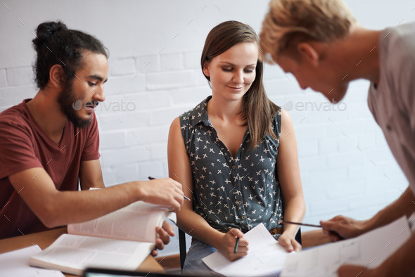 Comparing class notes Stock Photo by YuriArcursPeopleimages | PhotoDune