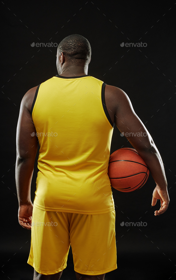 Back View of Muscular Basketball Player Stock Photo by seventyfourimages