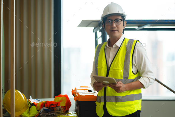 Construction engineer with technician designer team working build site ...