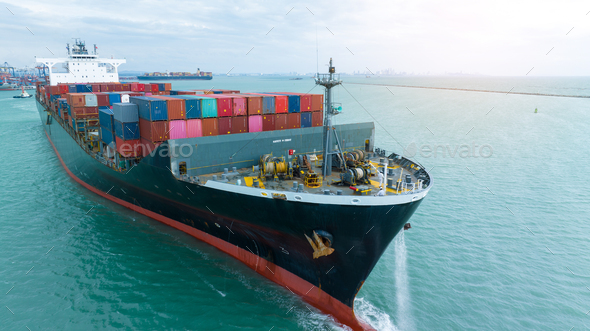 side view Cargo Container ship with contrail in the ocean ship carrying ...