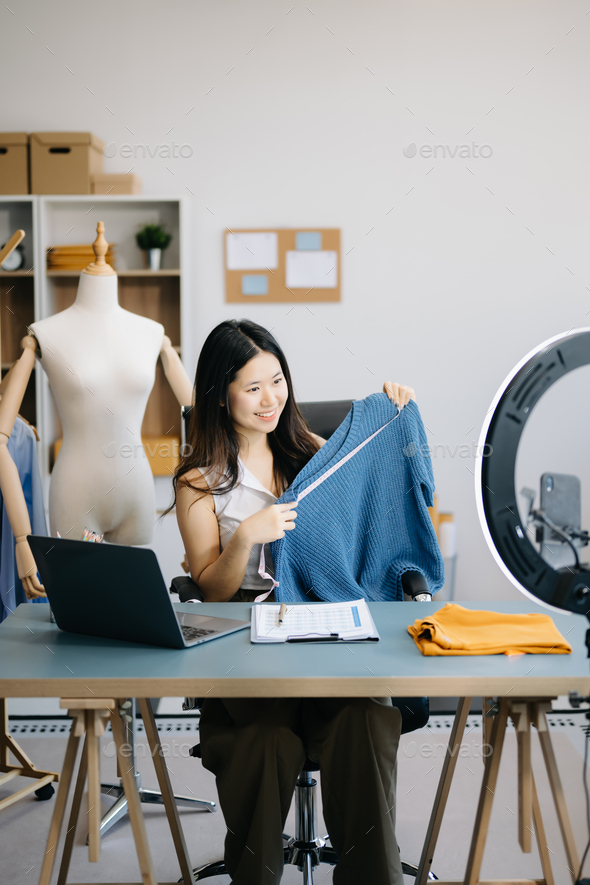 Attractive woman with smile while standing in workshop. Beautiful owner ...