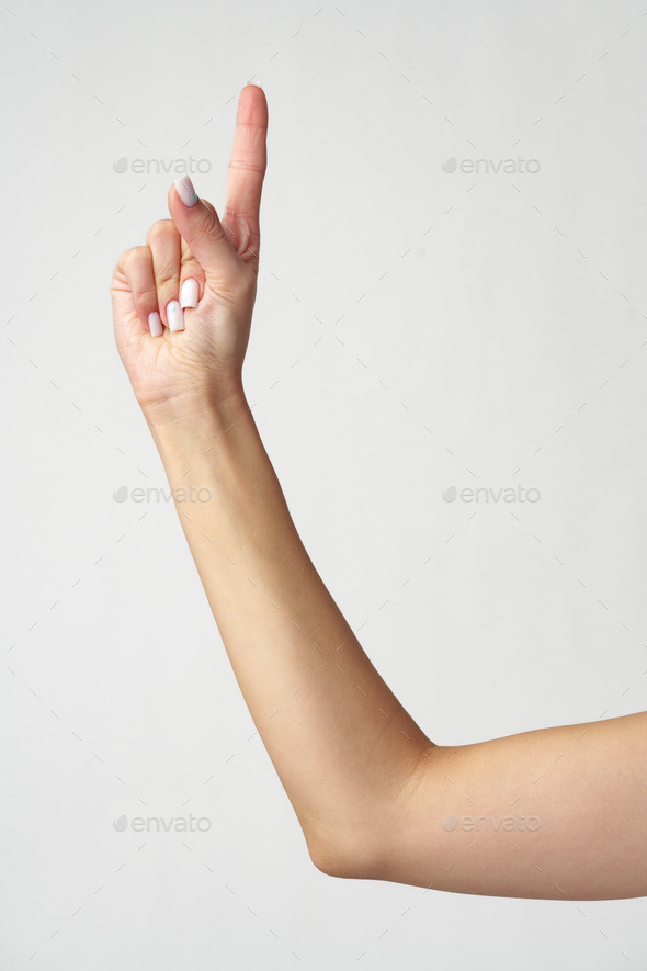 Female hand finger pointing on white background Stock Photo by FabrikaPhoto