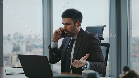 Ceo arguing phone call sitting office feeling despair closeup. Man ...