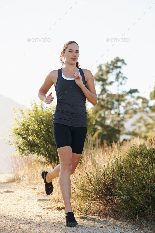 Running is part of her daily routine Stock Photo by YuriArcursPeopleimages